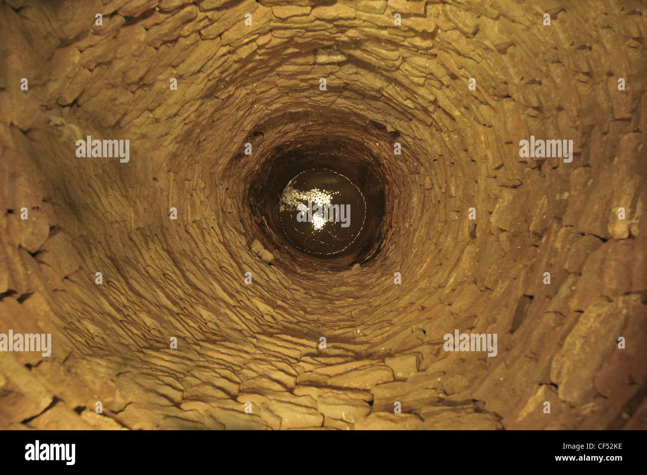 Deep stone well, showing a small amount of water at the bottom Stock ...