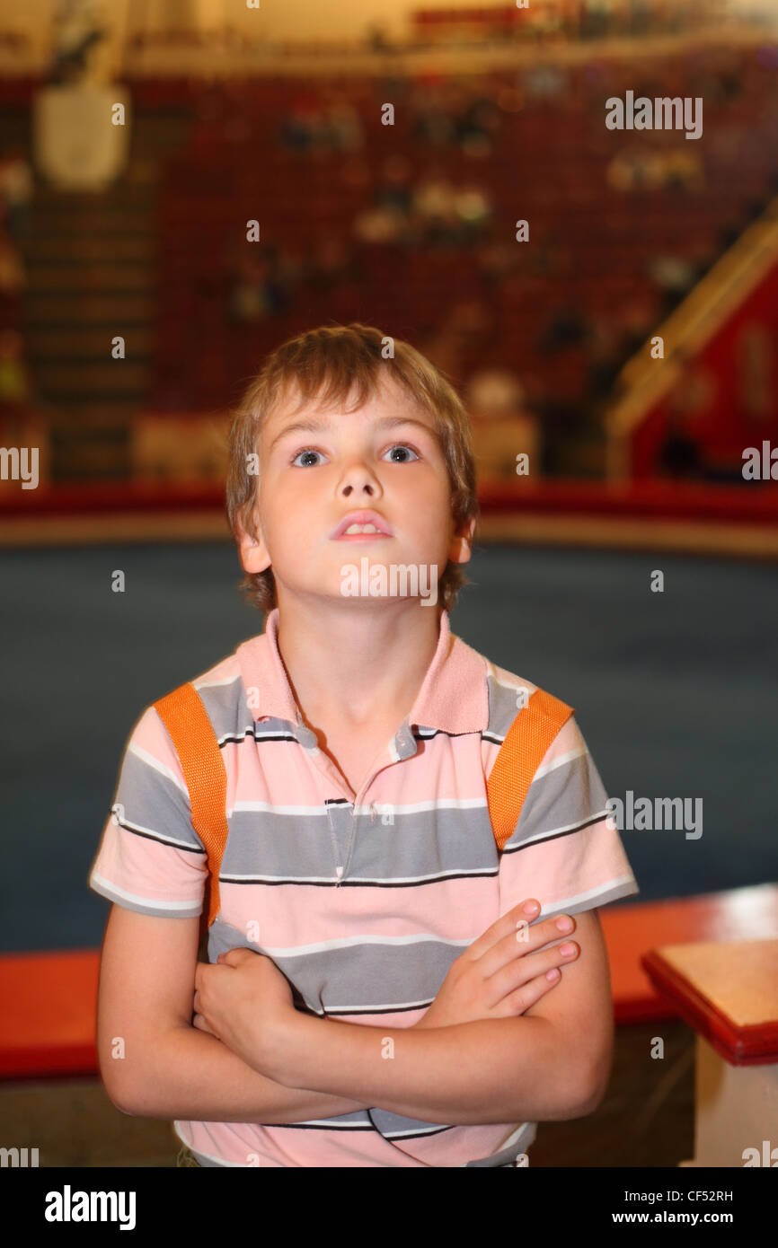 little boy in circus standing near arena and looking up half body Stock ...