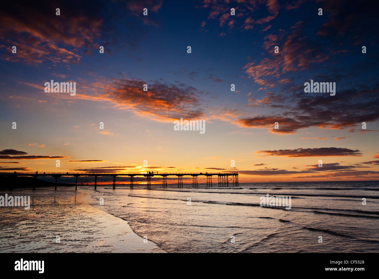 Sunset over the Victorian pier at Saltburn-By-The-Sea, the first and ...