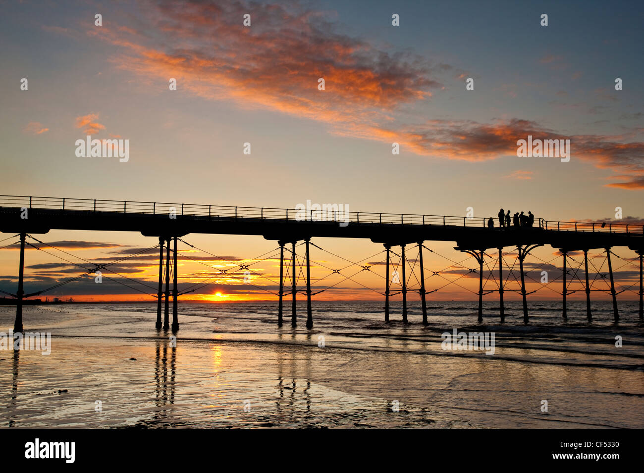 Sunset over the Victorian pier at Saltburn-By-The-Sea, the first and ...