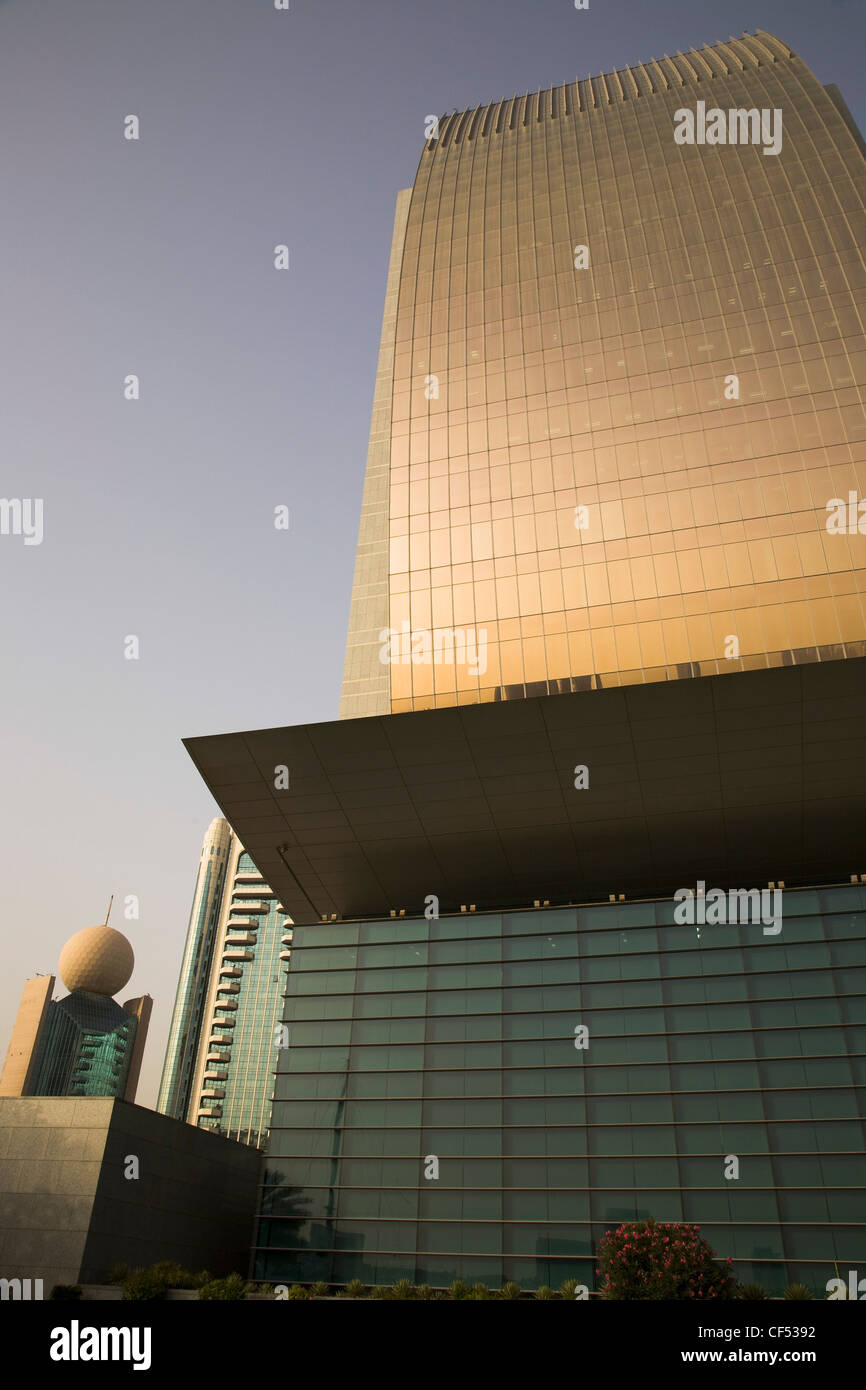 Curved glass facade of National Bank of Dubai building with Etisalat ...