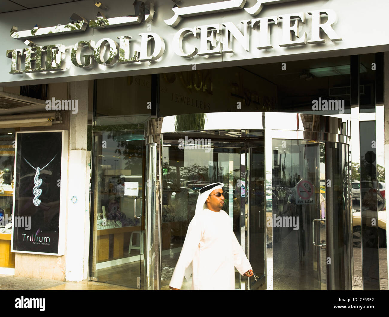 Emirati Arab man in Dishdasha passes Gold Center at Gold Souk Deira UAE ...