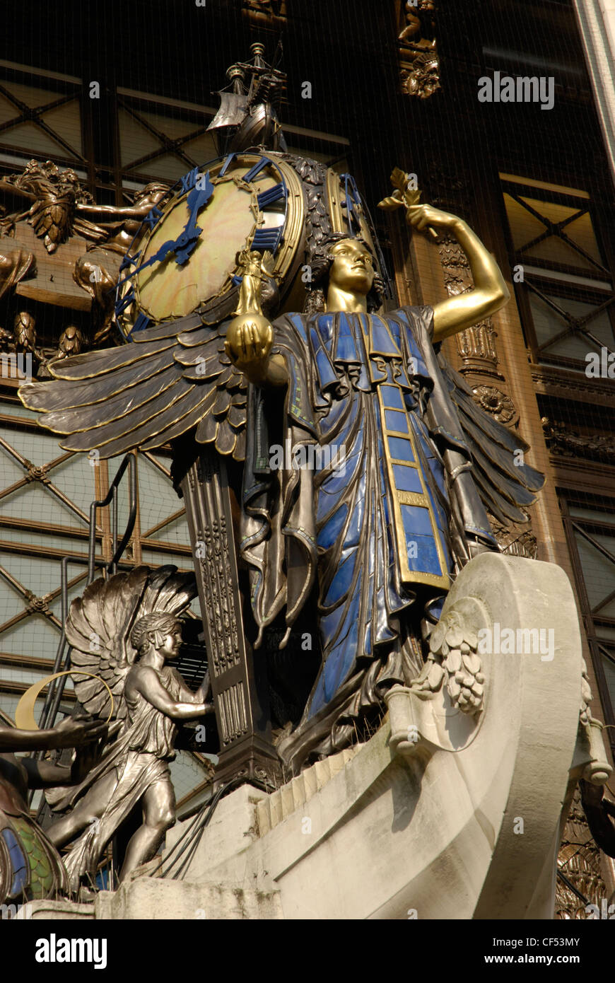 Close up of the Queen of Time statue and clock above the entrance to ...