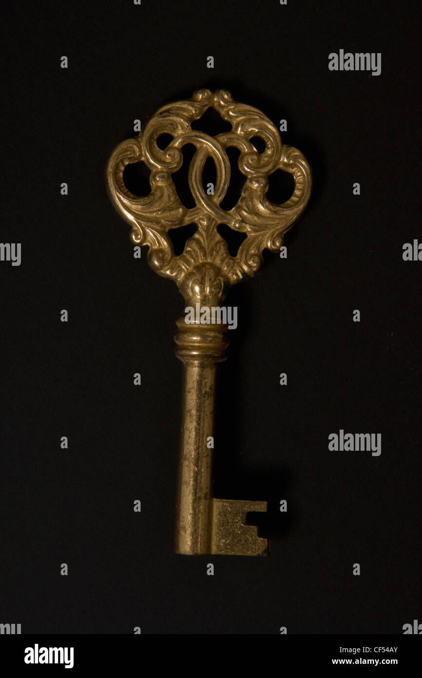 Old fancy key on black background, close up Stock Photo - Alamy