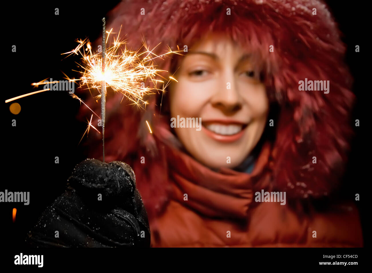 beautiful smiling young woman with Bengal fire in hand isolated on ...