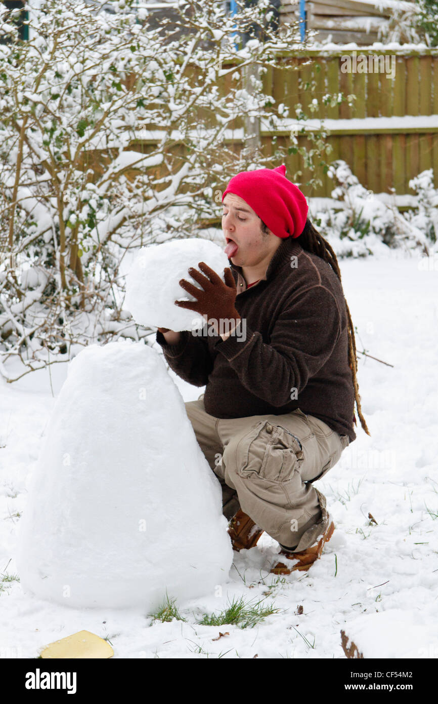 Adult building a snowman uk hi-res stock photography and images - Alamy