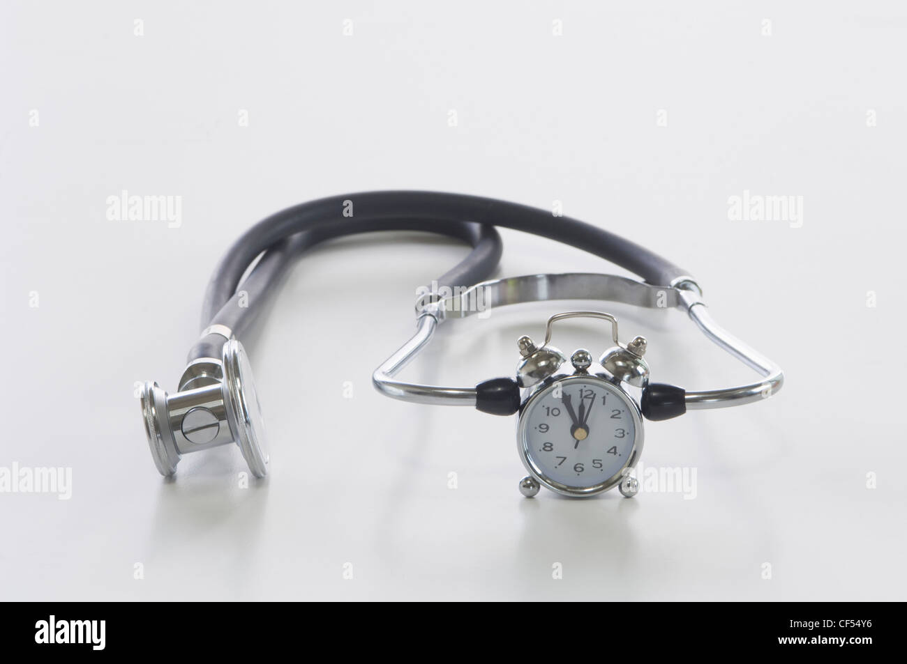 Stethoscope with alarm clock on white background, close up Stock Photo ...