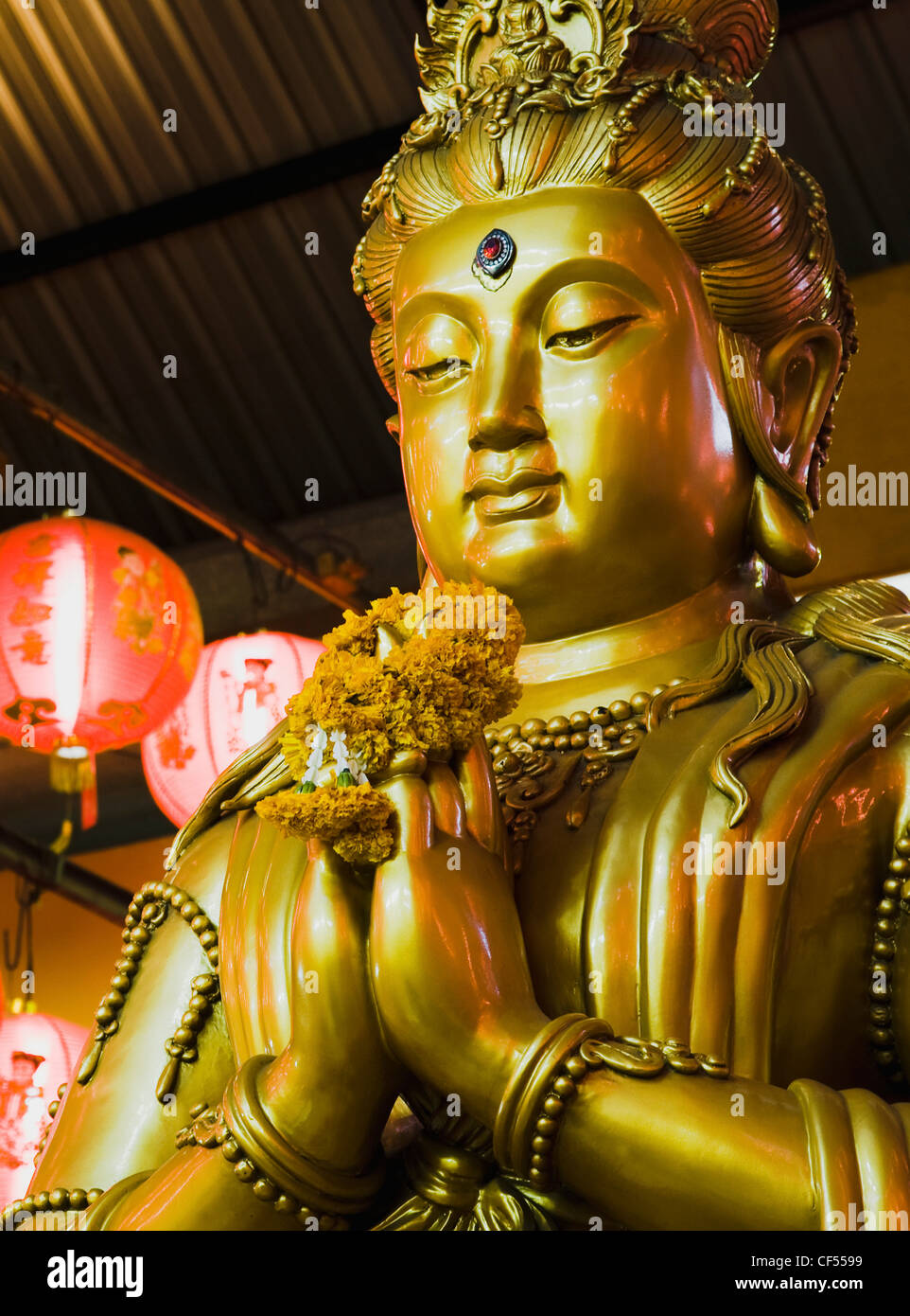 Gold Guanyin Goddess of Mercy statue with red lanterns for Chinese New ...