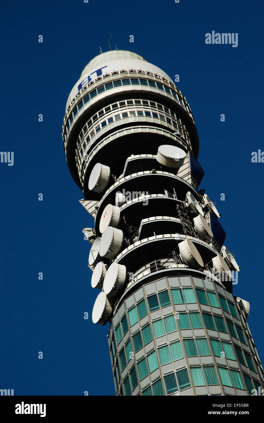The top of the British Telecom Tower against a deep blue sky in London ...