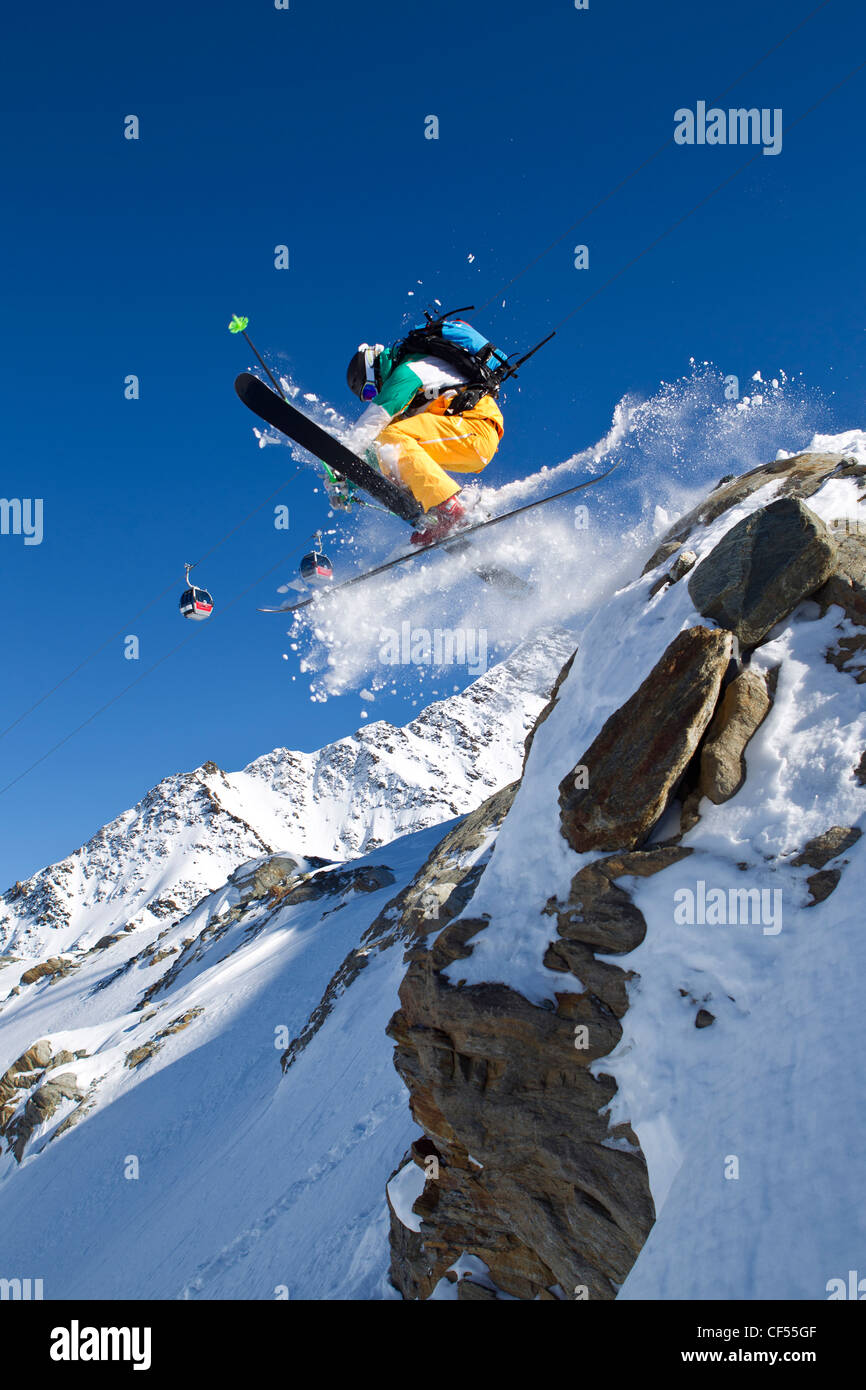 Austria, Tyrol, Pitztal, Mature man doing freestyle skiing Stock Photo ...