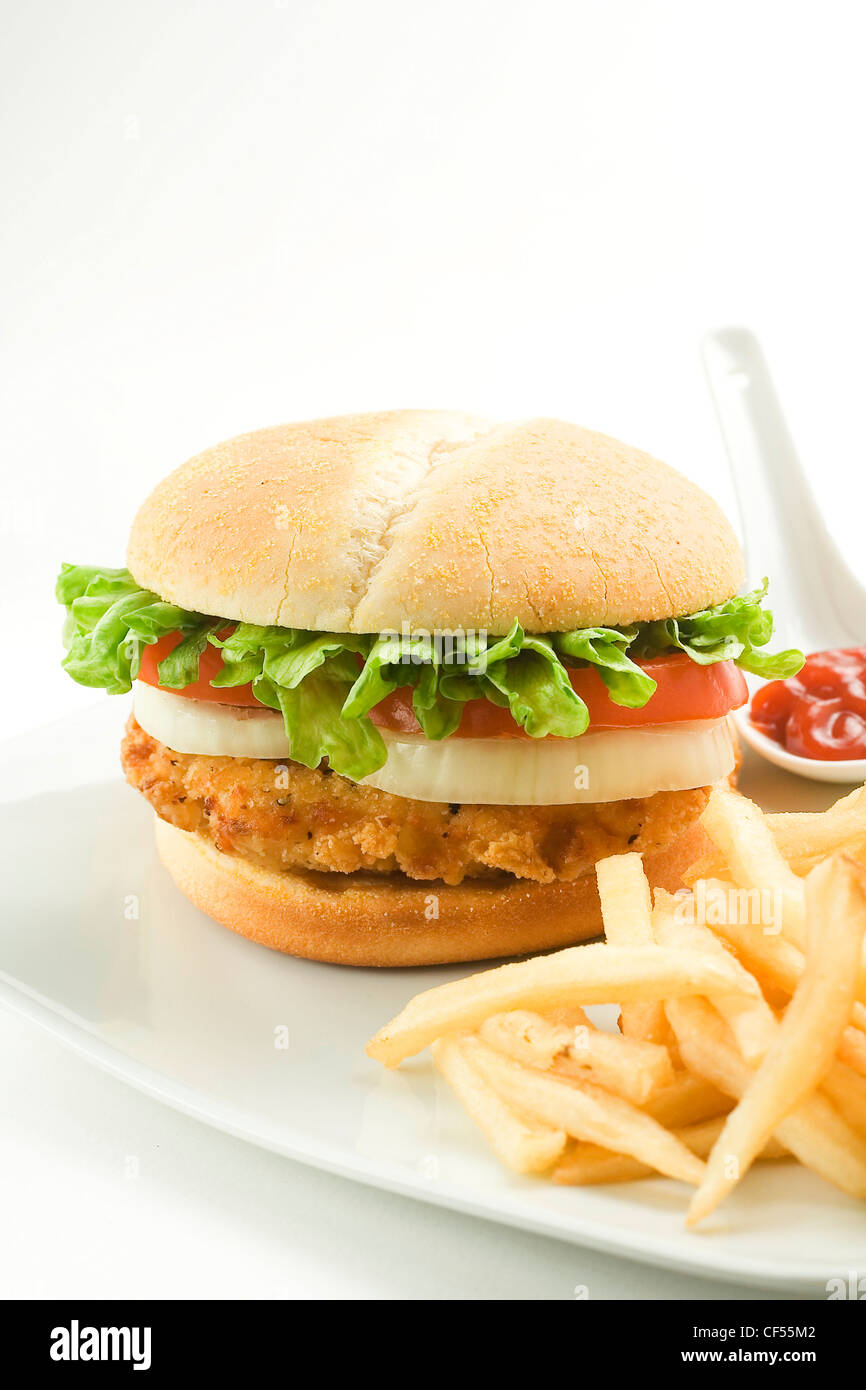 crisp chicken burger with tomato onion cheese lettuce Stock Photo - Alamy