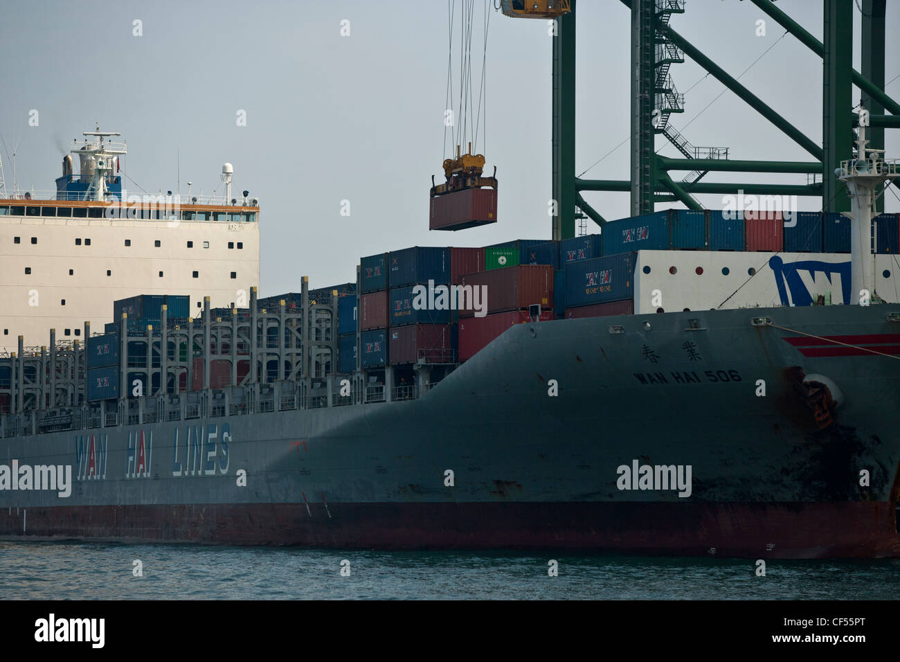 Container ships are seen moored at the Pasir Panjang terminal of the ...