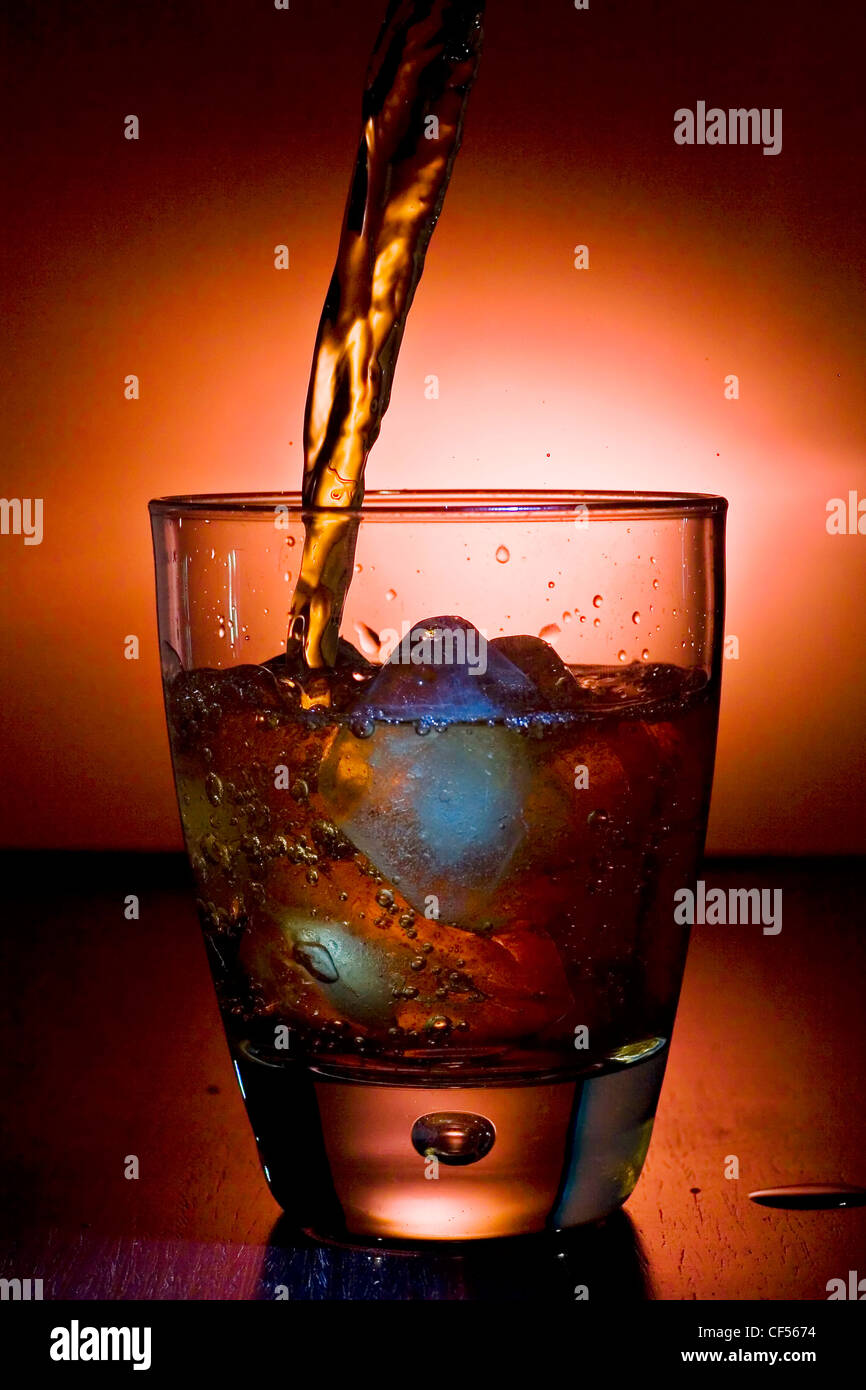 alcoholic beverage whith ice cubes Stock Photo - Alamy
