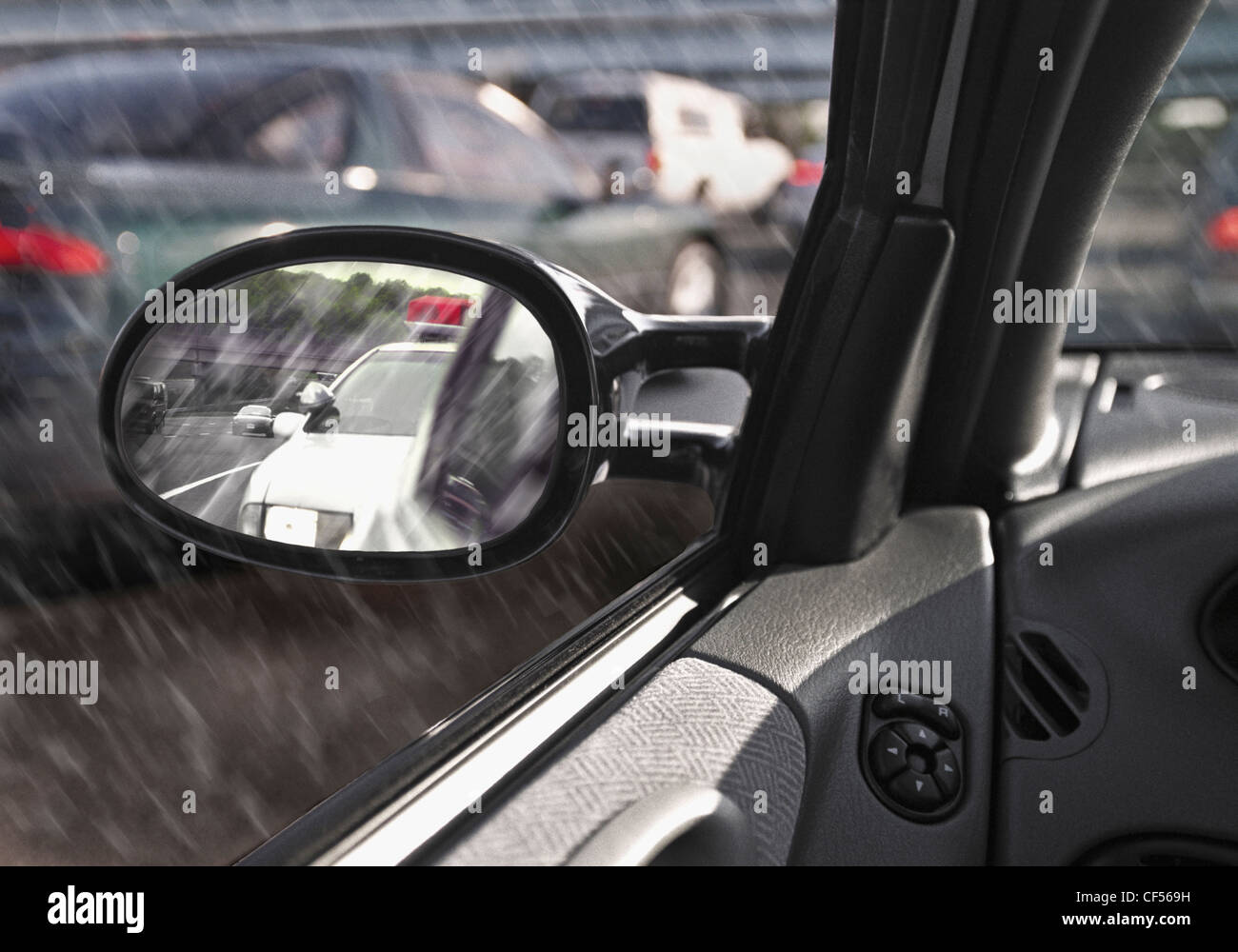 police car in rearview mirror in the rain Stock Photo - Alamy