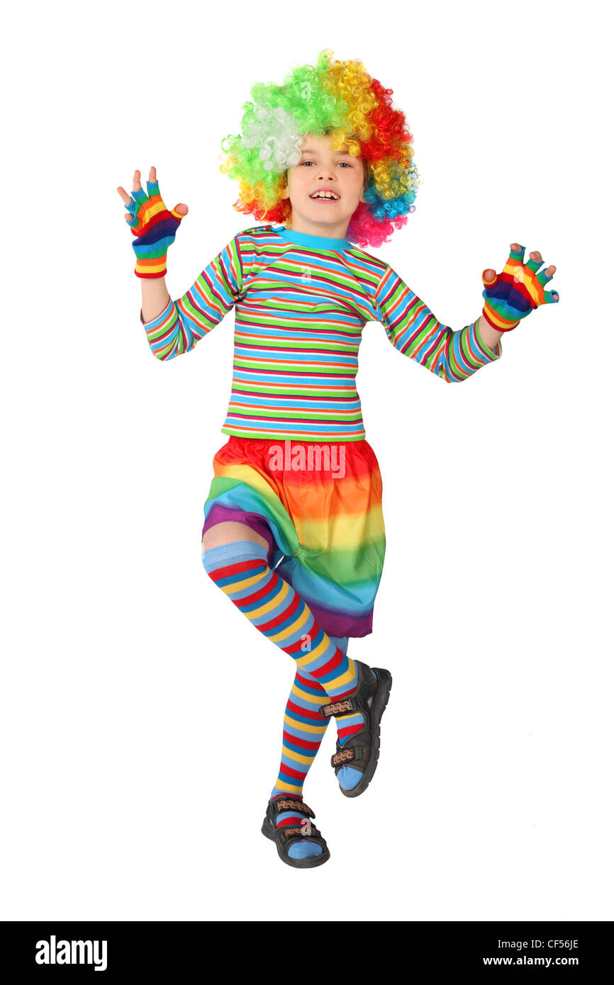little boy in clown dress standing on one leg isolated on white ...