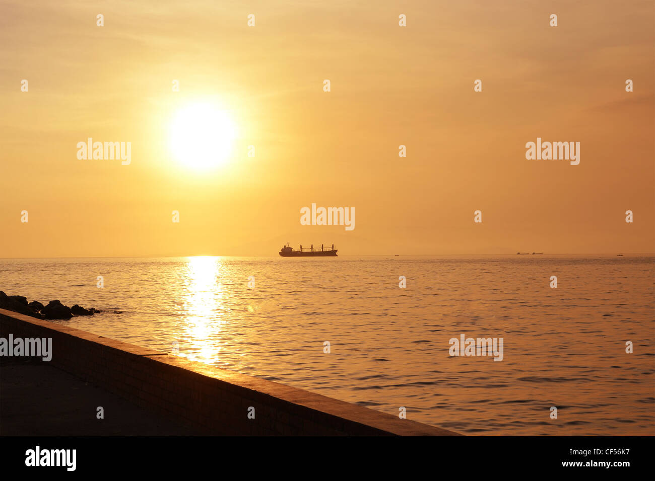 a golden sunset view from manila bay Stock Photo - Alamy