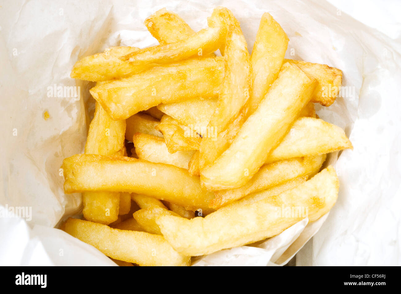Chips in paper Stock Photo - Alamy