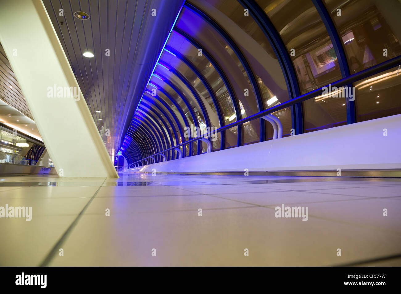 Long corridor with big windows in modern building at night ...