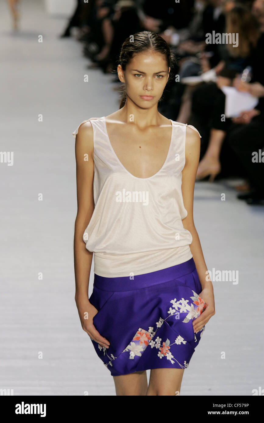 Paco Rabanne Female model dark brown hair wearing a sleeveless, loose ...