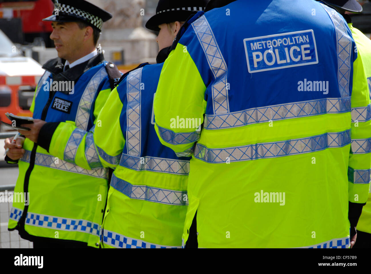 A close up of London Metropolitan Police in bright yellow and blue ...