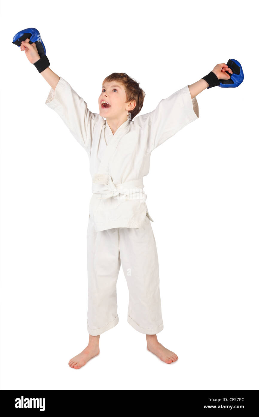 little boxer boy in white dress and blue boxing gloves hands up ...