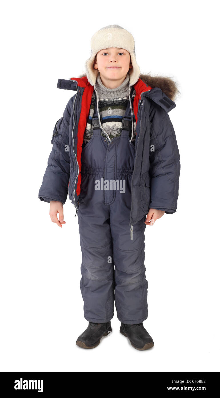little boy in winter dress standing and smiling isolated on white ...