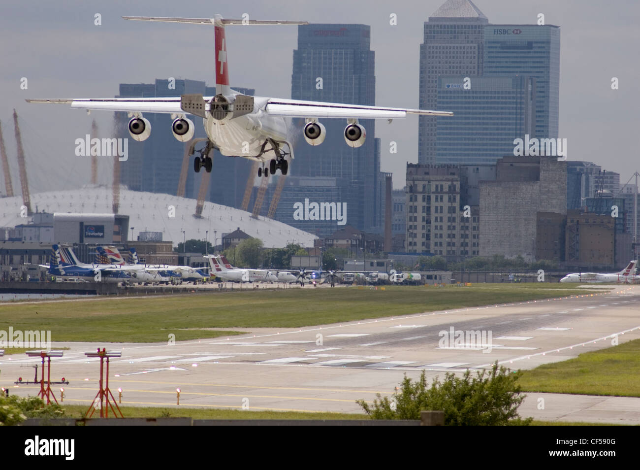 A Swiss Air BAe 146 airplane landing at London City Airport with ...