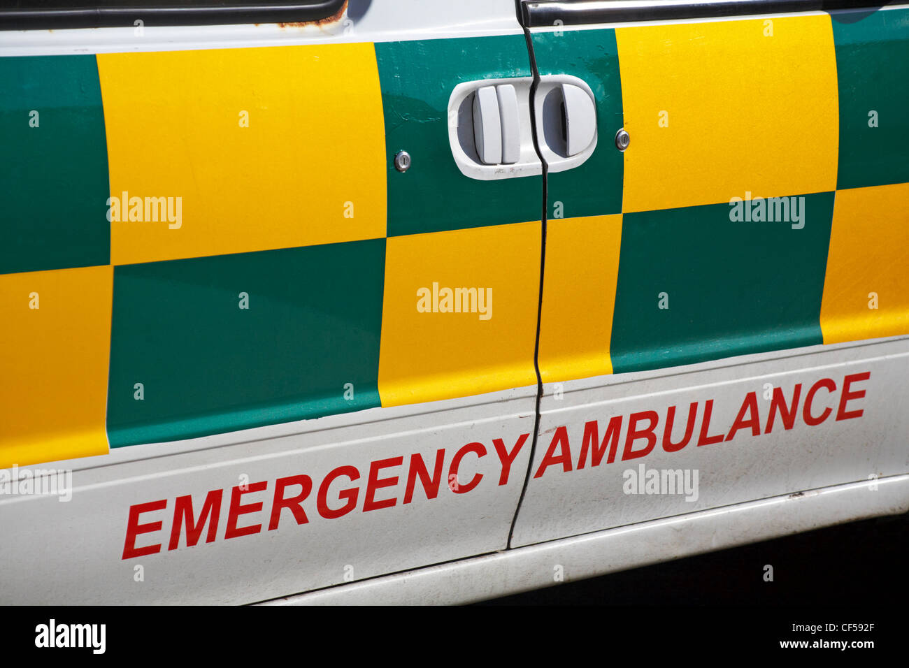 green and yellow rectangles painted on side of emergency ambulance ...