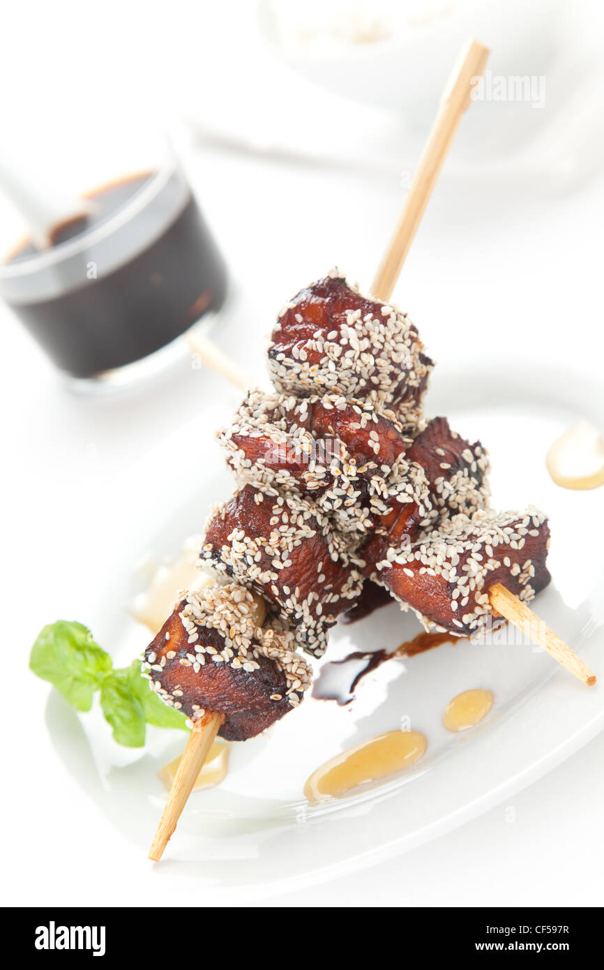 Sesame chicken isolated Cut Out Stock Images & Pictures - Alamy