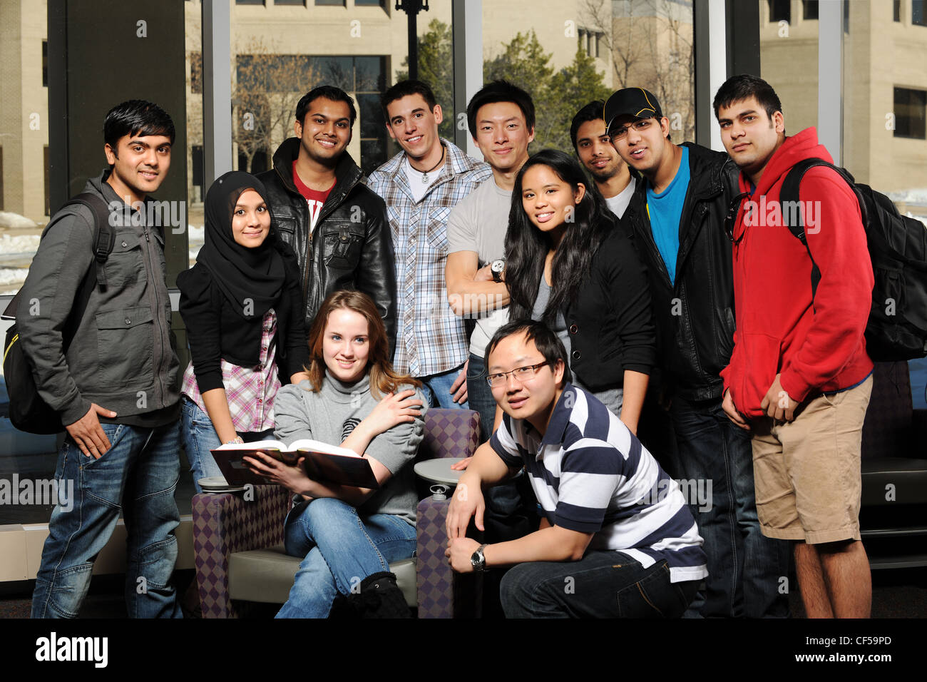 Diverse Group of Students in College Campus with buildings on the ...