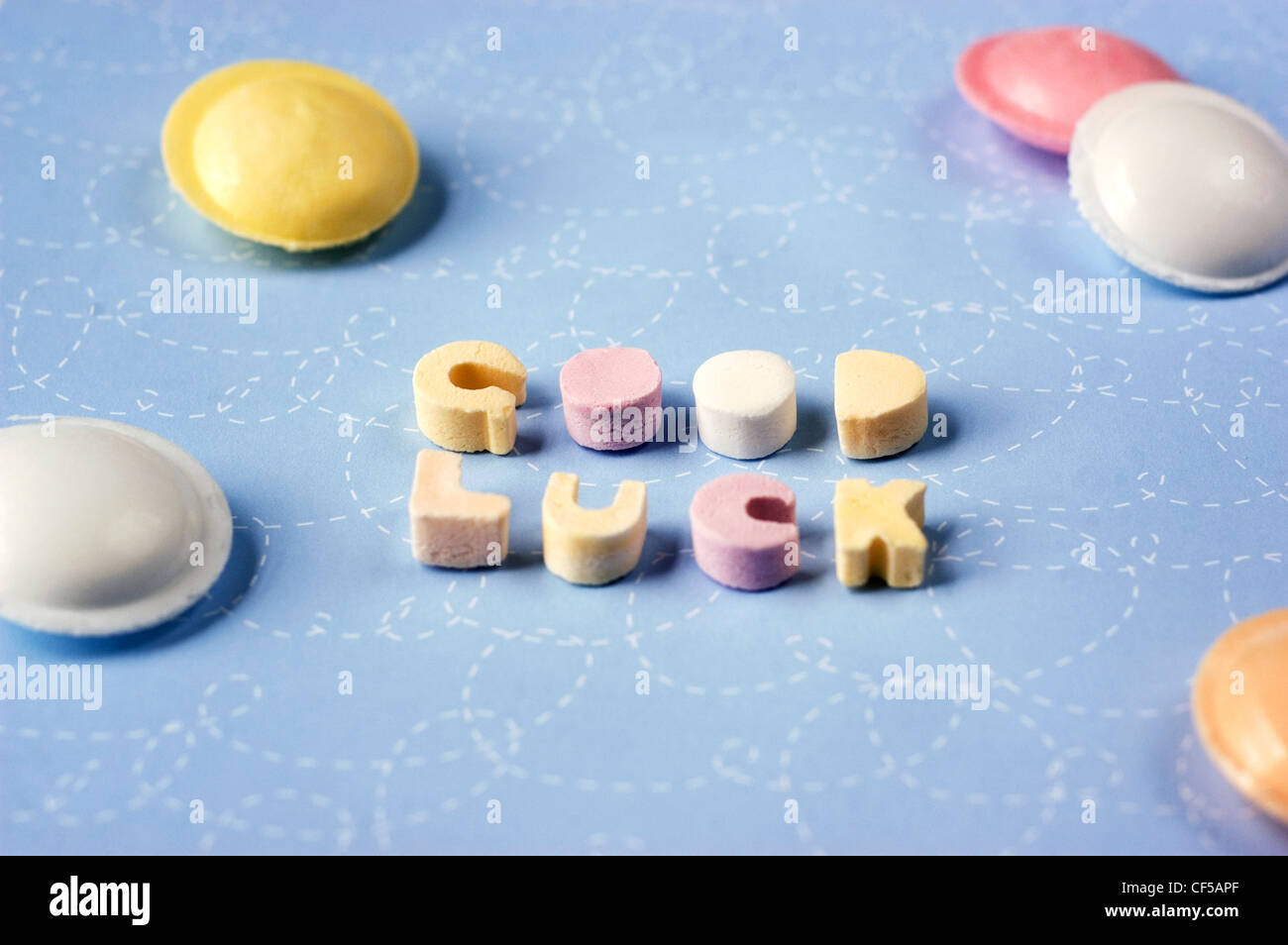 Sugar letter shaped sweets spelling the words good luck Stock Photo - Alamy
