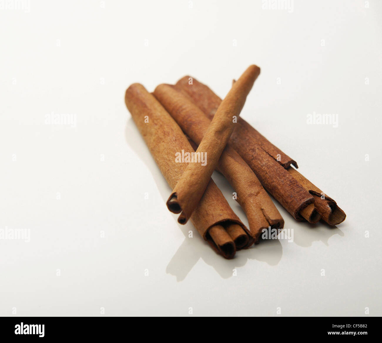 Cinnamon bark on white background, close up Stock Photo - Alamy