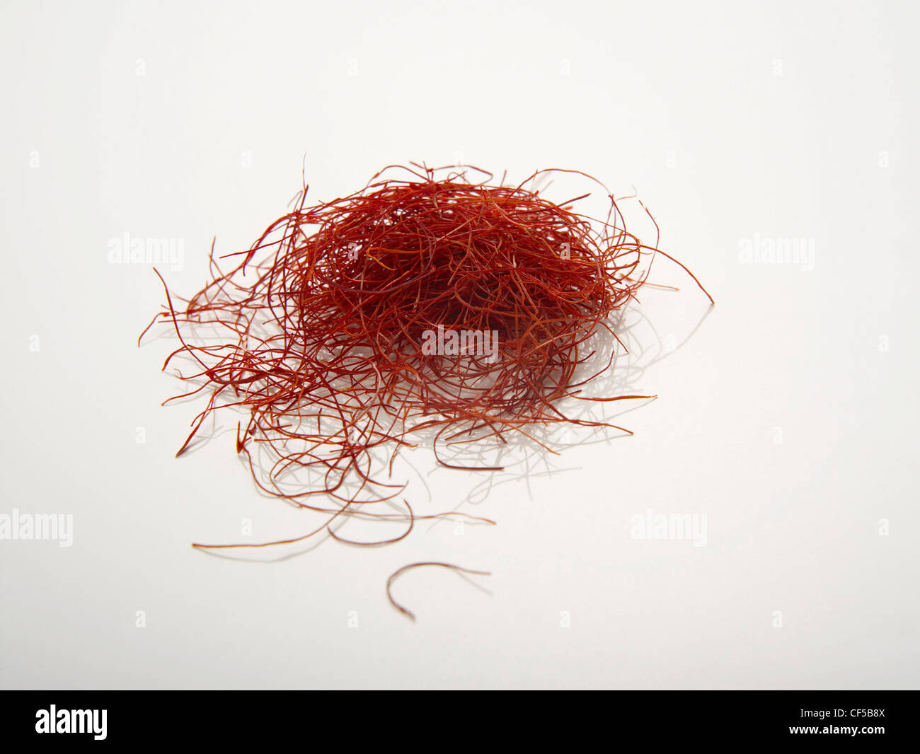 Chilli threads on white background Stock Photo - Alamy