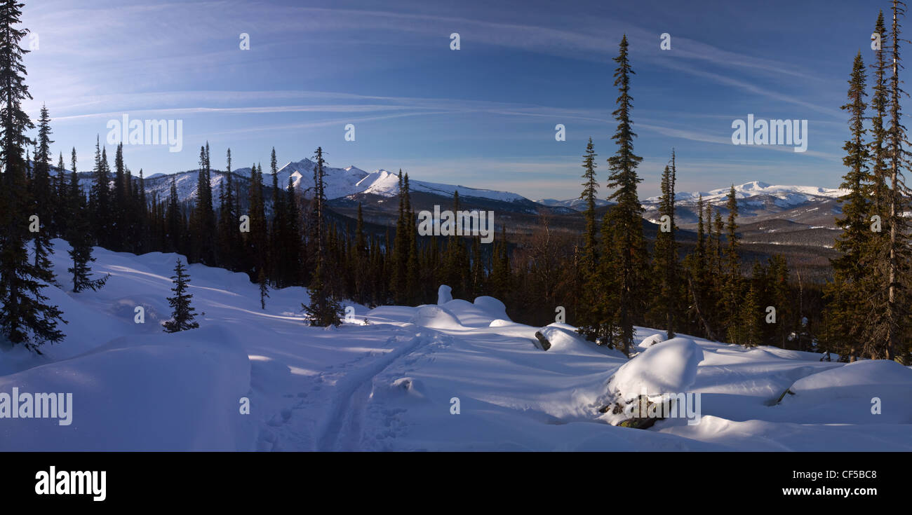 Snow rocks and taiga forest in Siberia mountains. Kuznetskiy Alatau ...