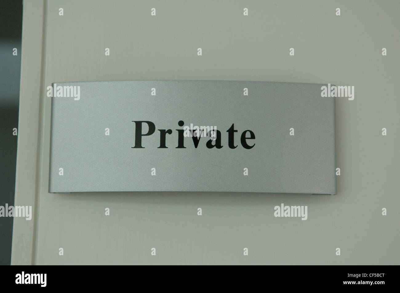 A silver private sign on a wall Stock Photo - Alamy