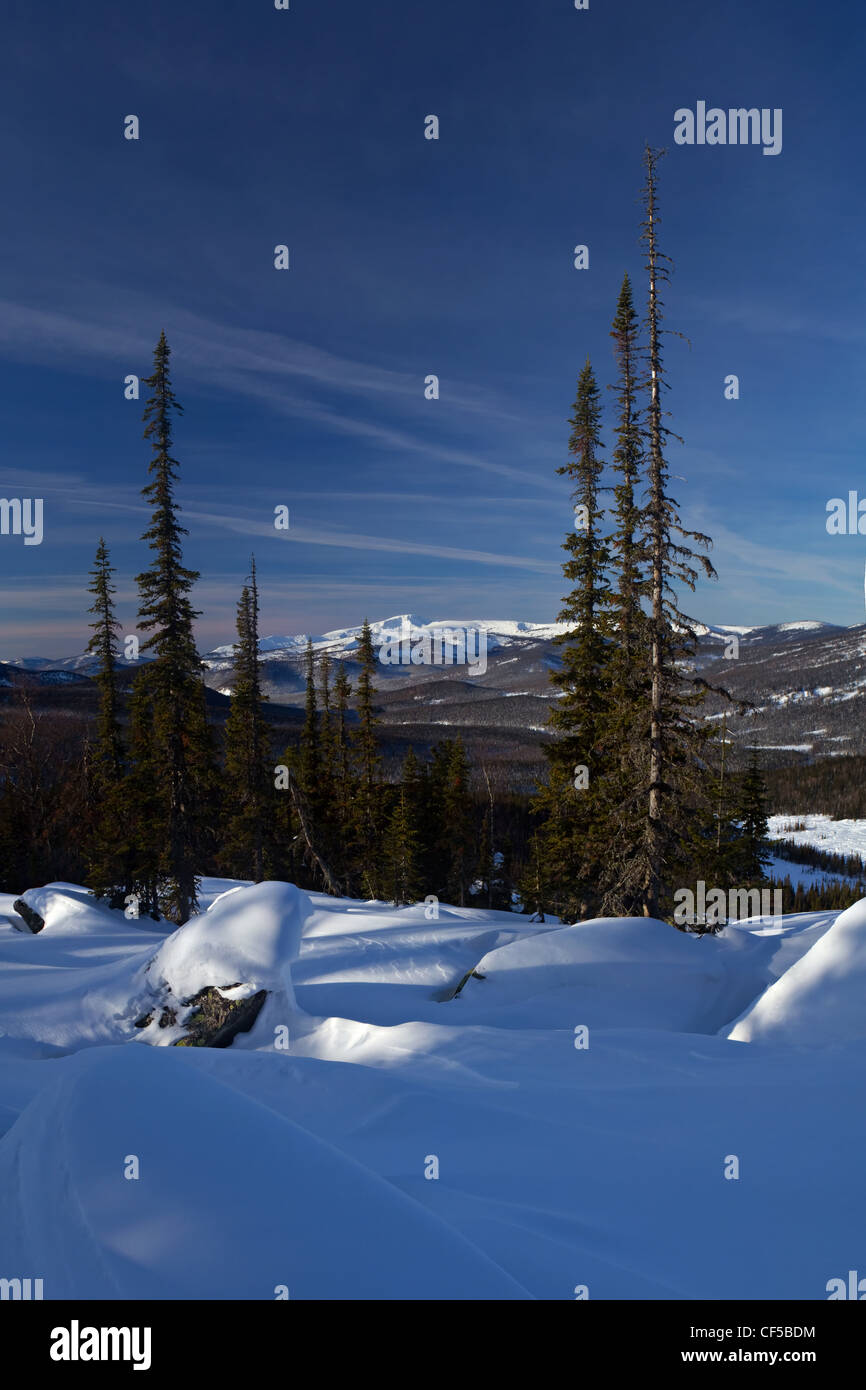 Snow rocks and taiga forest in Siberia mountains. Kuznetskiy Alatau ...