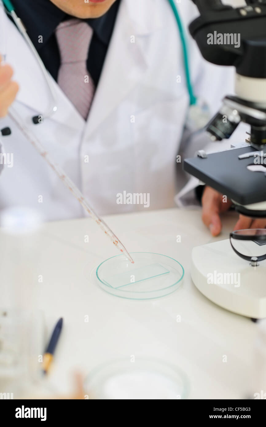 Closeup on working with samples researcher Stock Photo - Alamy