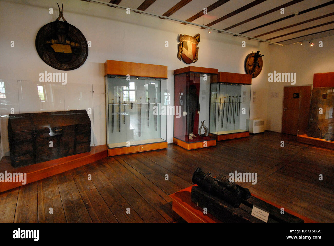 A museum display of an array of ancient weapons and armoury in the ...