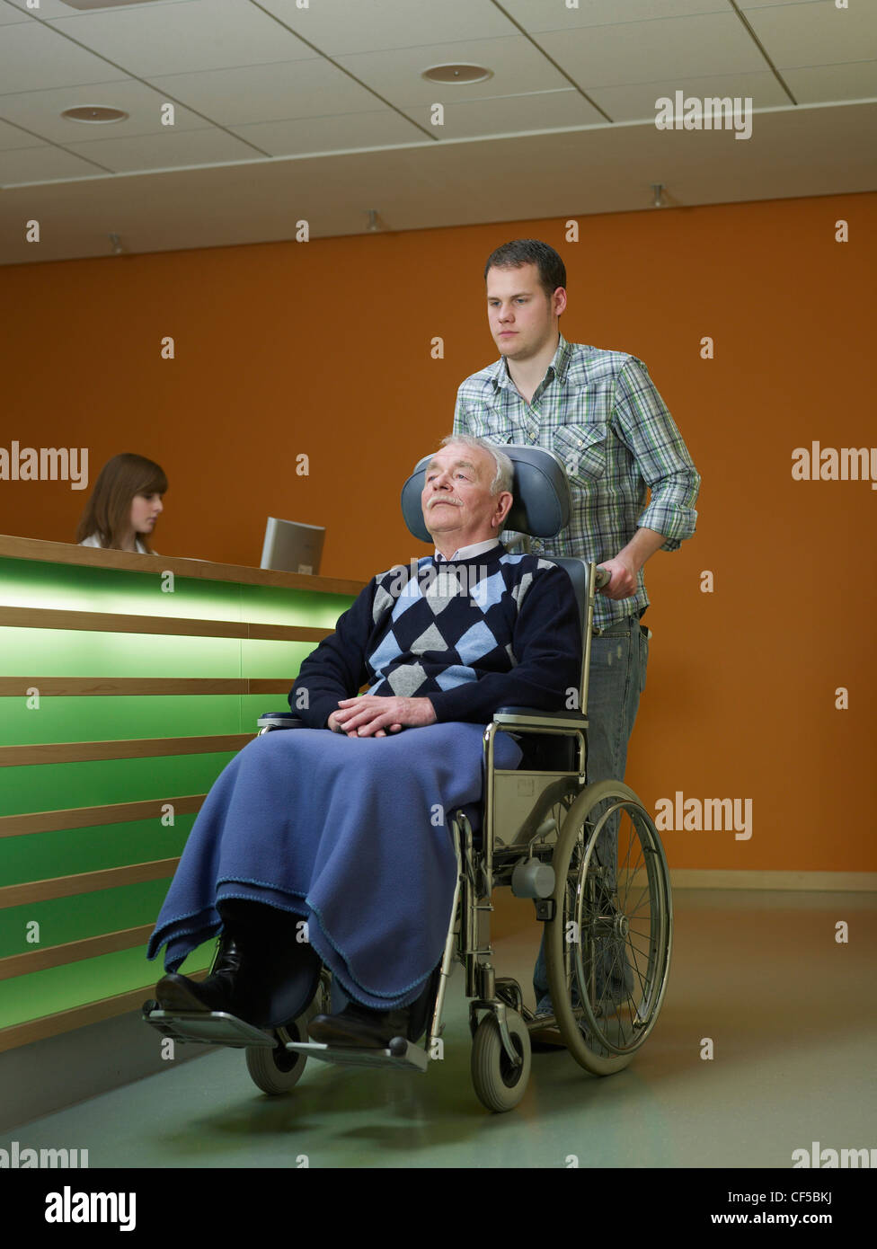 Germany, Hamburg, Man pushing senior man in wheel chair Stock Photo - Alamy