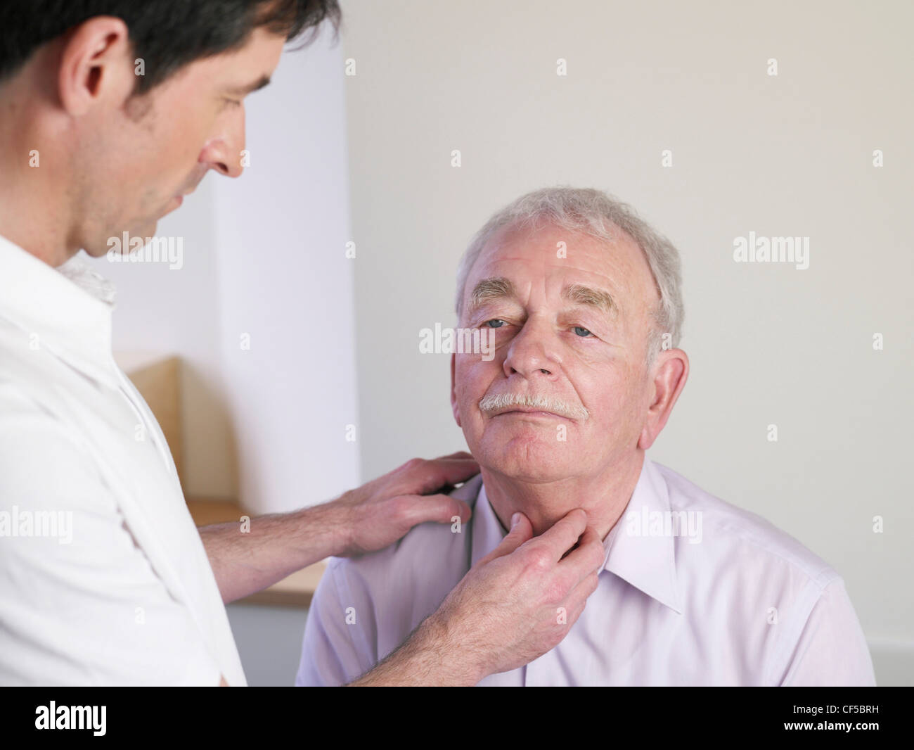 Germany, Hamburg, Doctor examining patient in doctor's office Stock ...