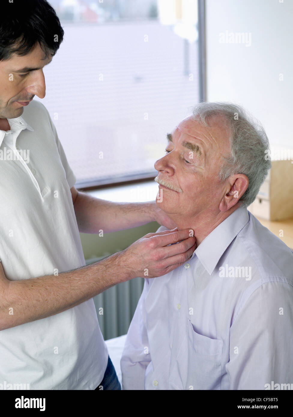 Germany, Hamburg, Doctor examining patient in clinic Stock Photo - Alamy
