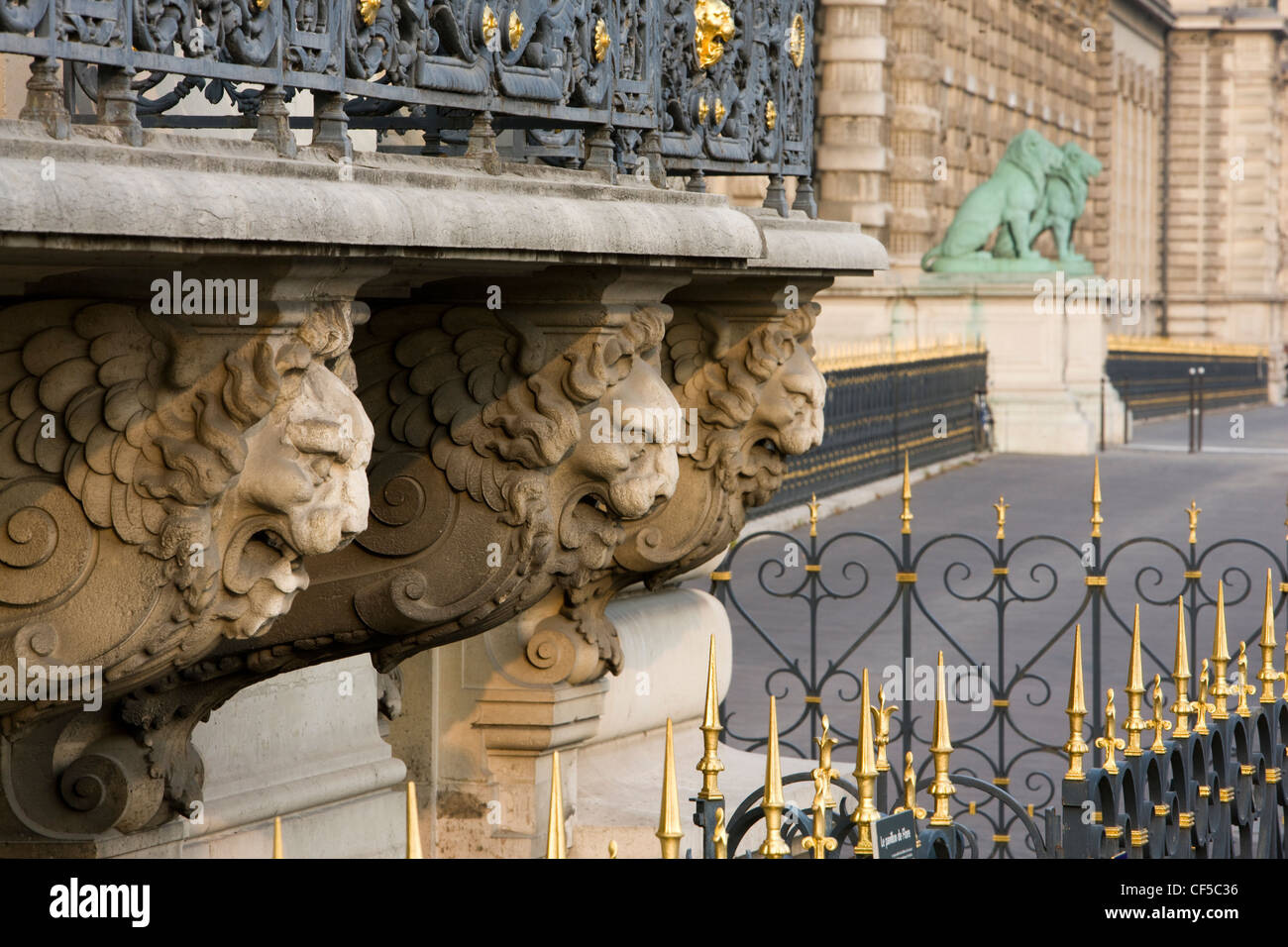 Stone lions outside The Louvre Museum in Paris Stock Photo - Alamy