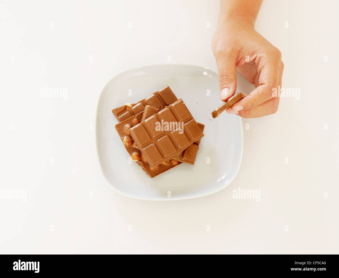 Human hands holding chocolate bar hi-res stock photography and images ...