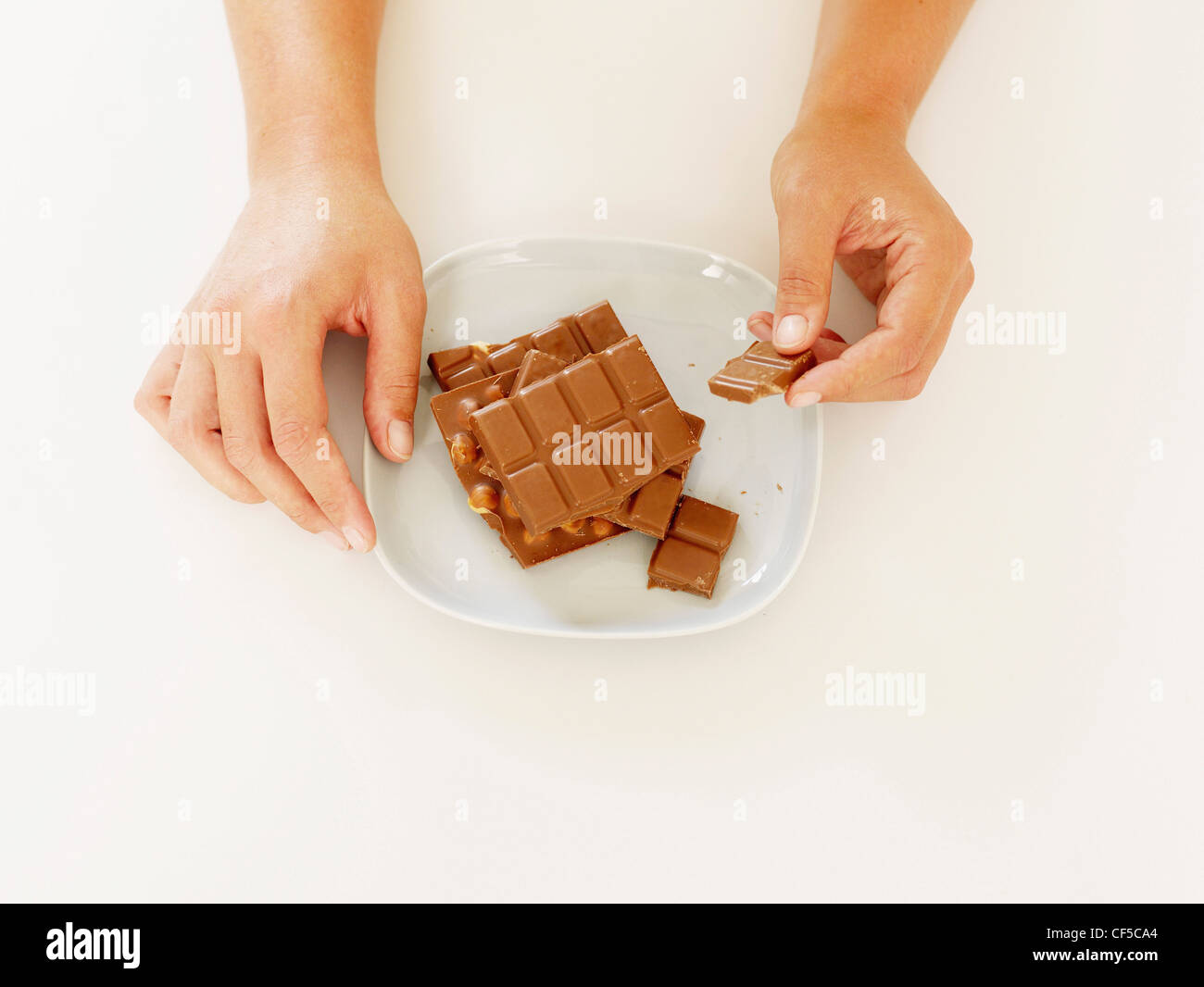 Human hands holding chocolate bar, close up Stock Photo - Alamy