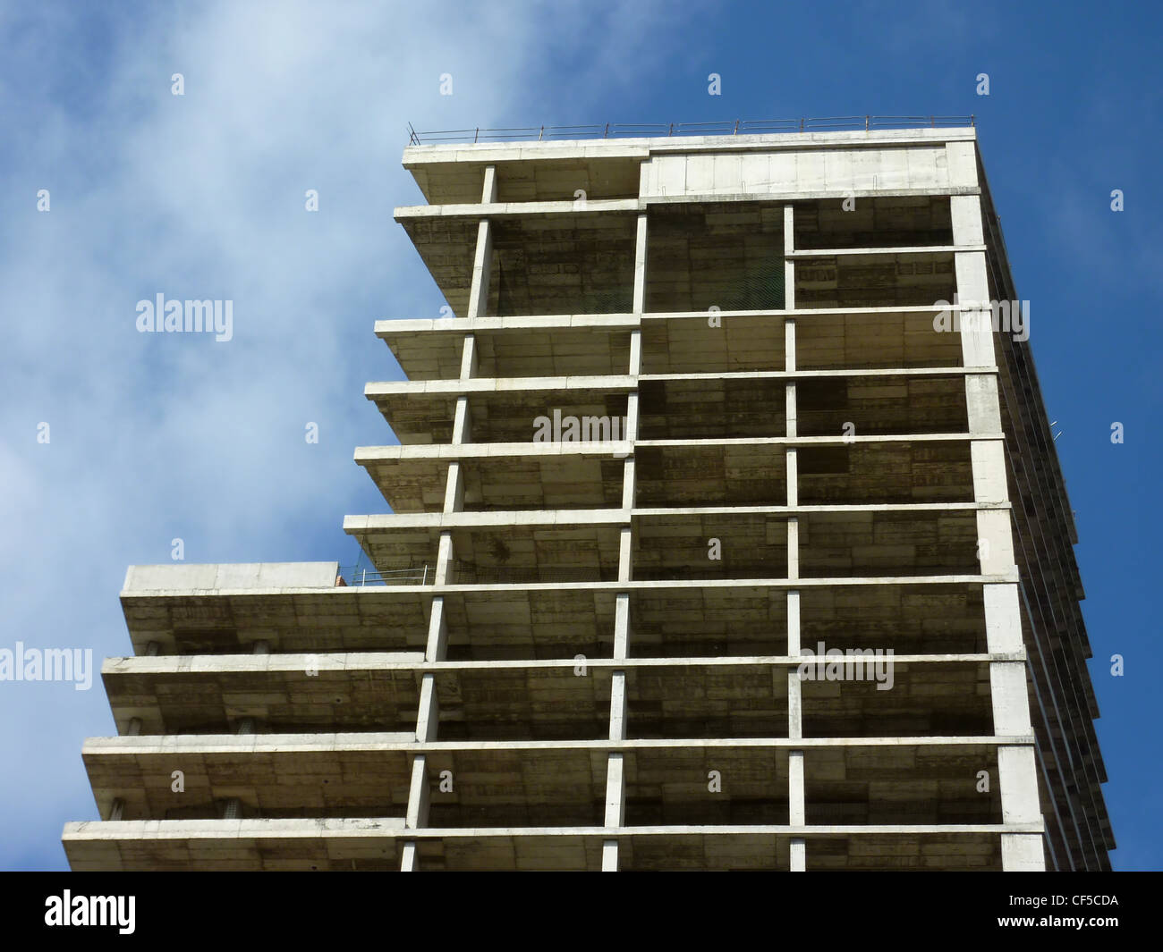 Not complete building structure and clouds in the sky Stock Photo - Alamy