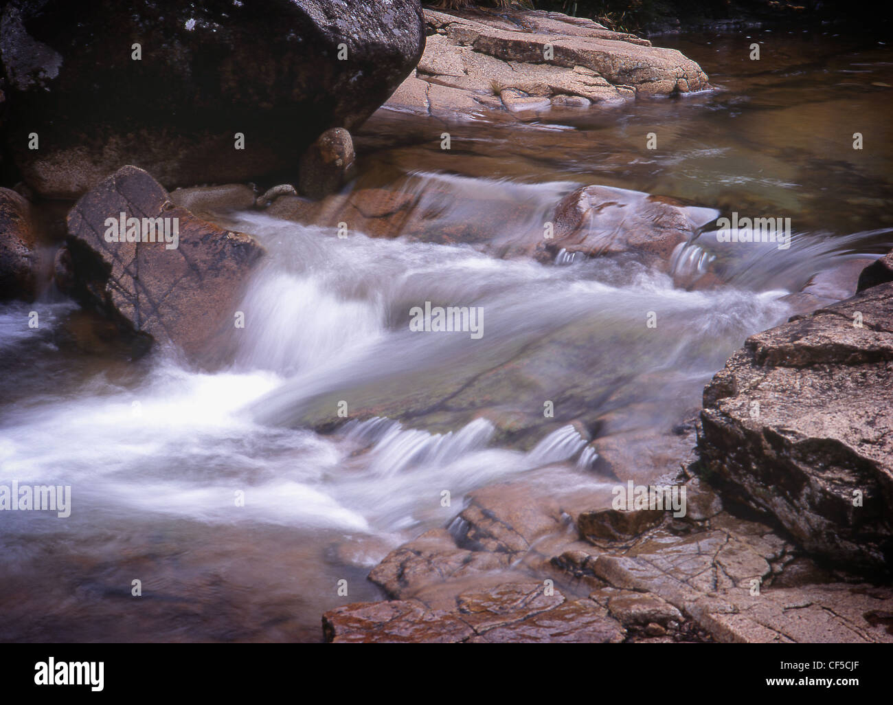Detail view of waterfall with pink granite rock formations Stock Photo ...