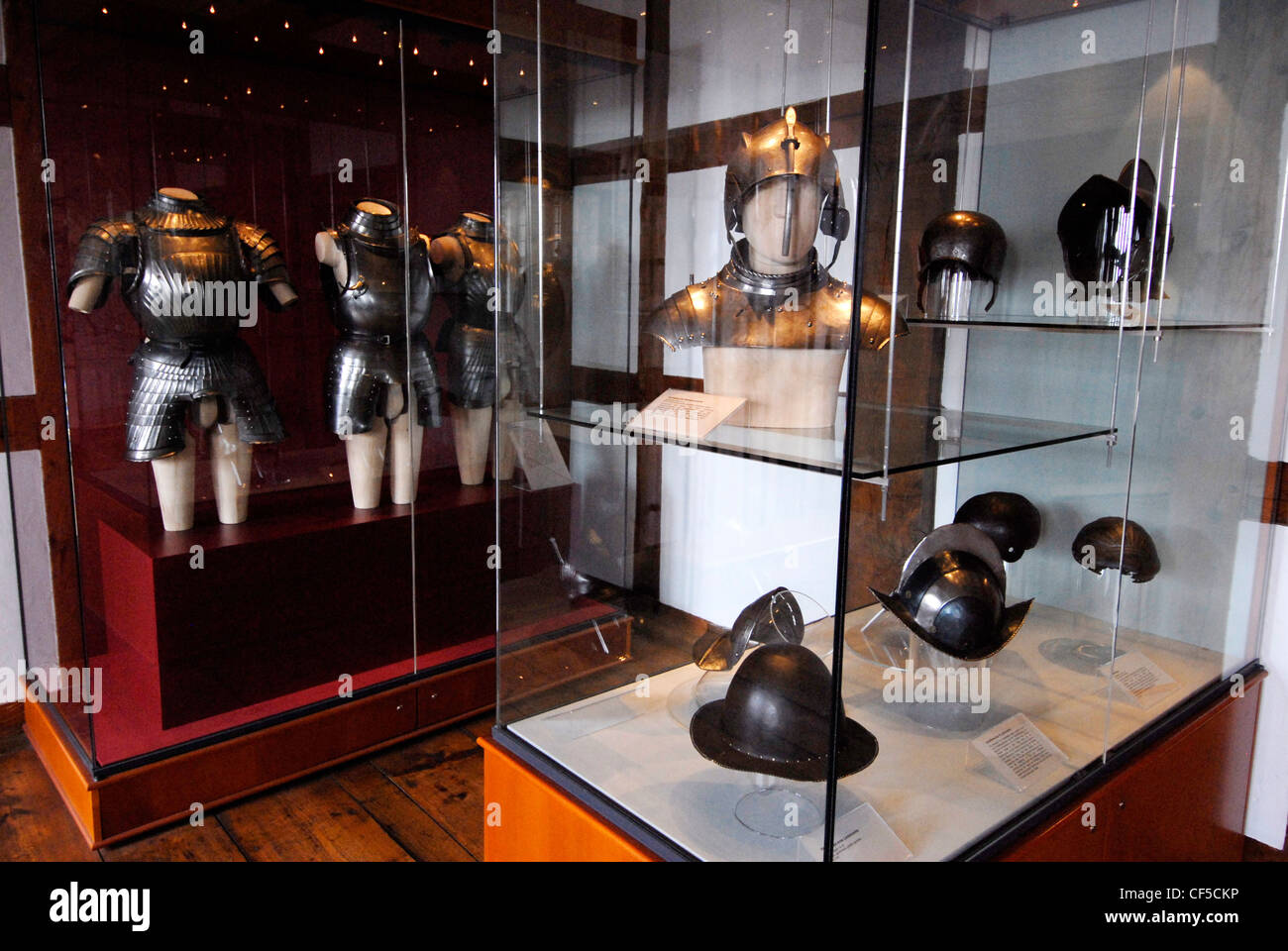 A museum display of a knight's armour suit and helmets in the imperial ...