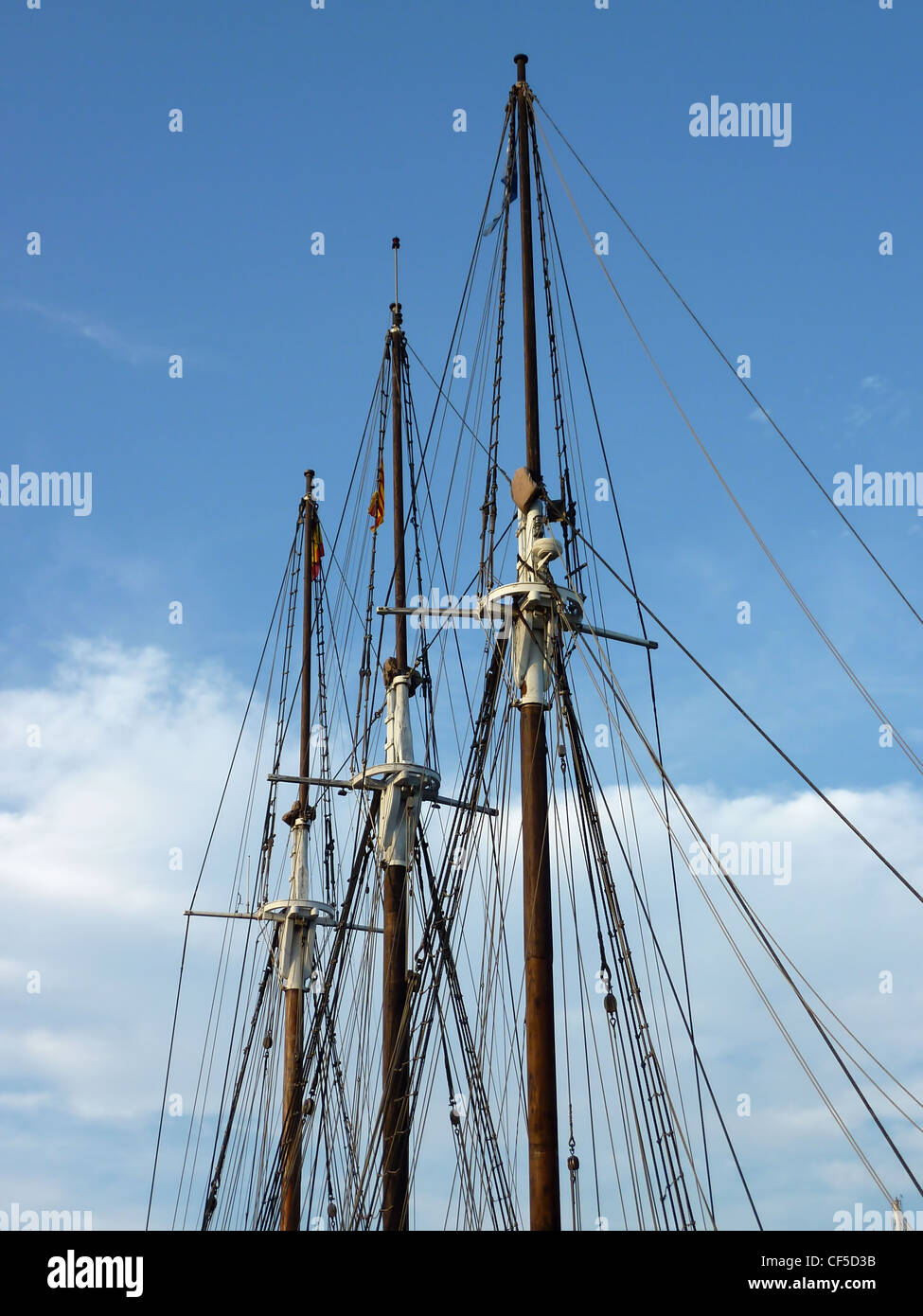 Three masts of a historical boat and clouds and blue sky Stock Photo ...
