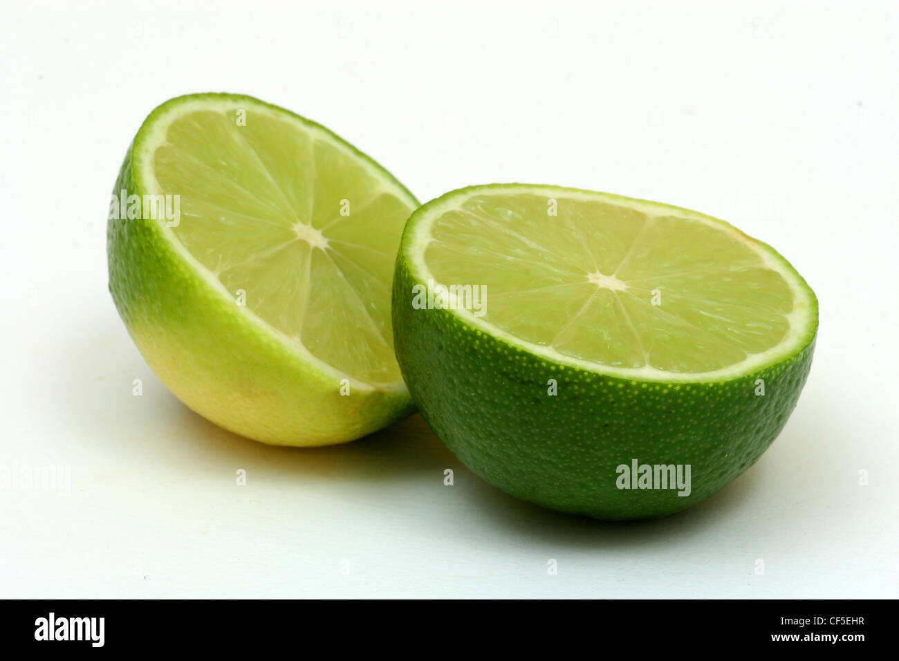A cut out of a lime cut in half Stock Photo - Alamy