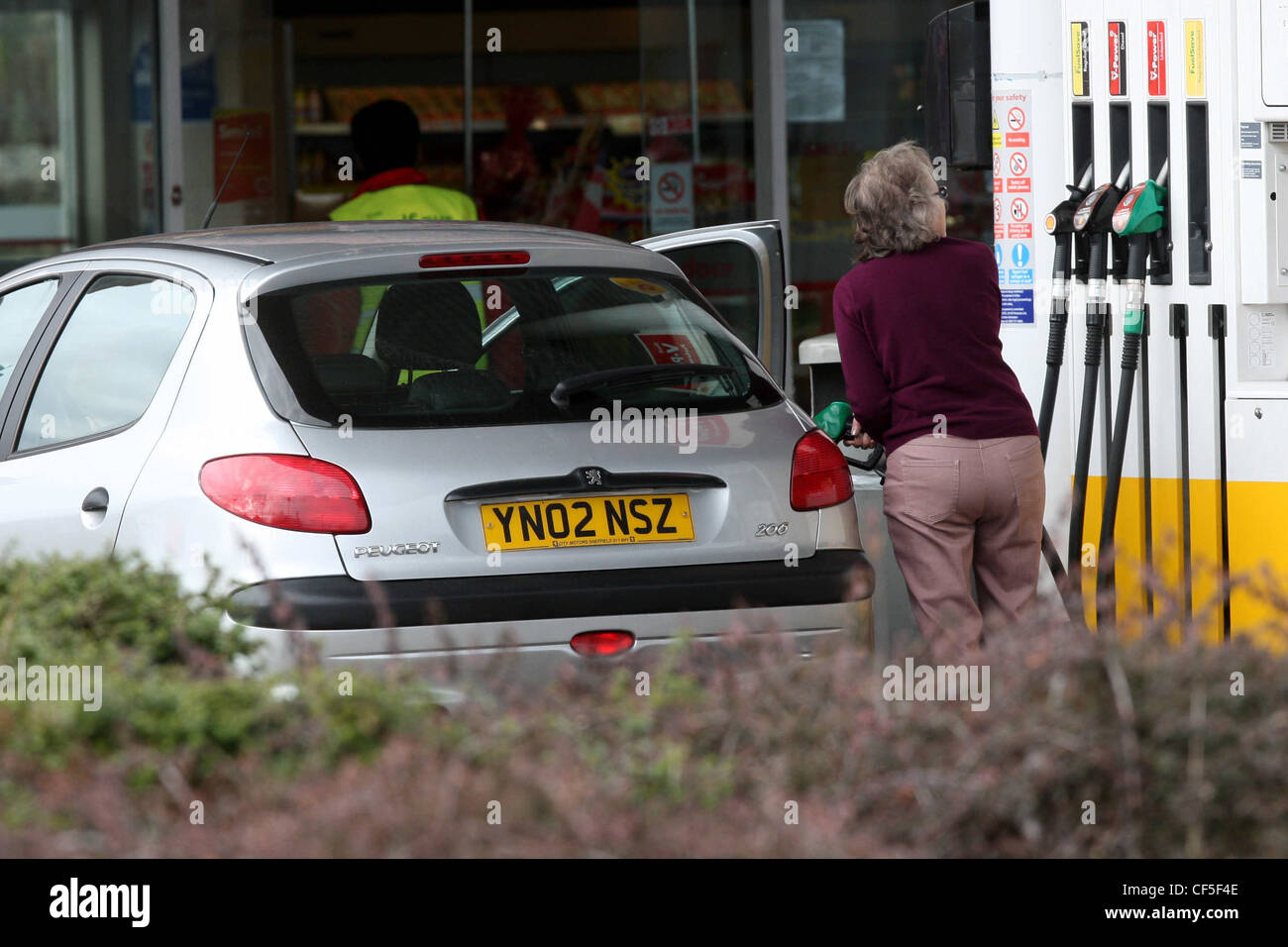 Woman shell petrol hi-res stock photography and images - Alamy